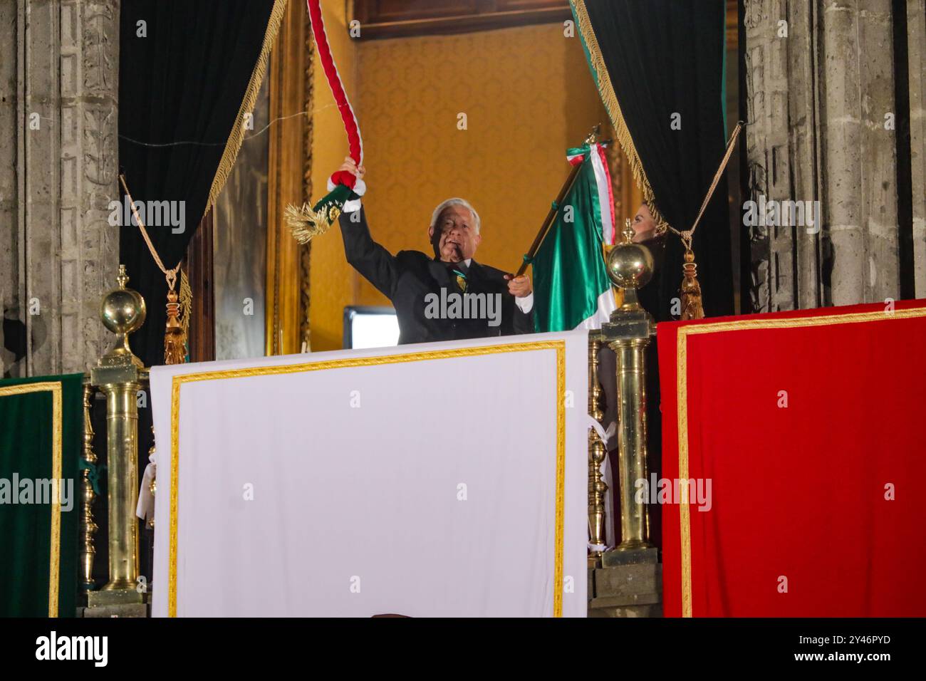 Mexico's President, Andres Manuel Lopez Obrador weaves the Mexican flag ...