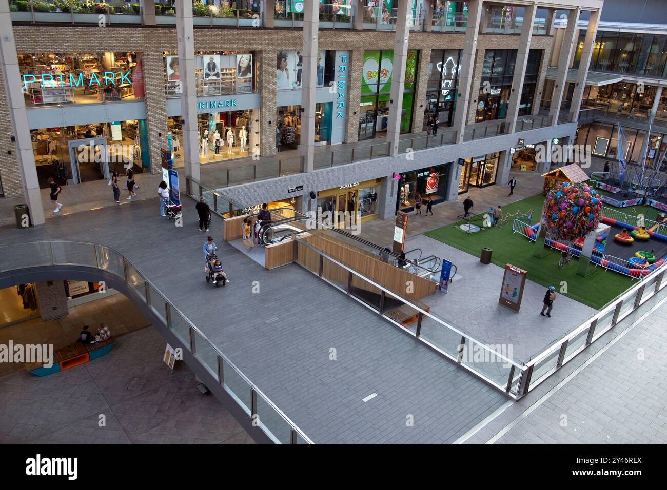 High view of people on walkways strolling shopping at Westgate shopping ...