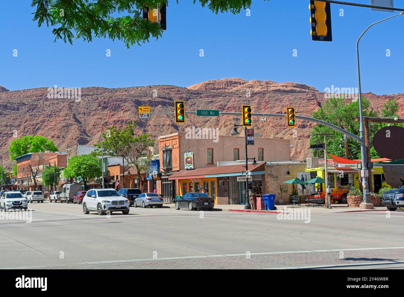 Downtown commercial streetscape with red Moab rim cliffs background ...