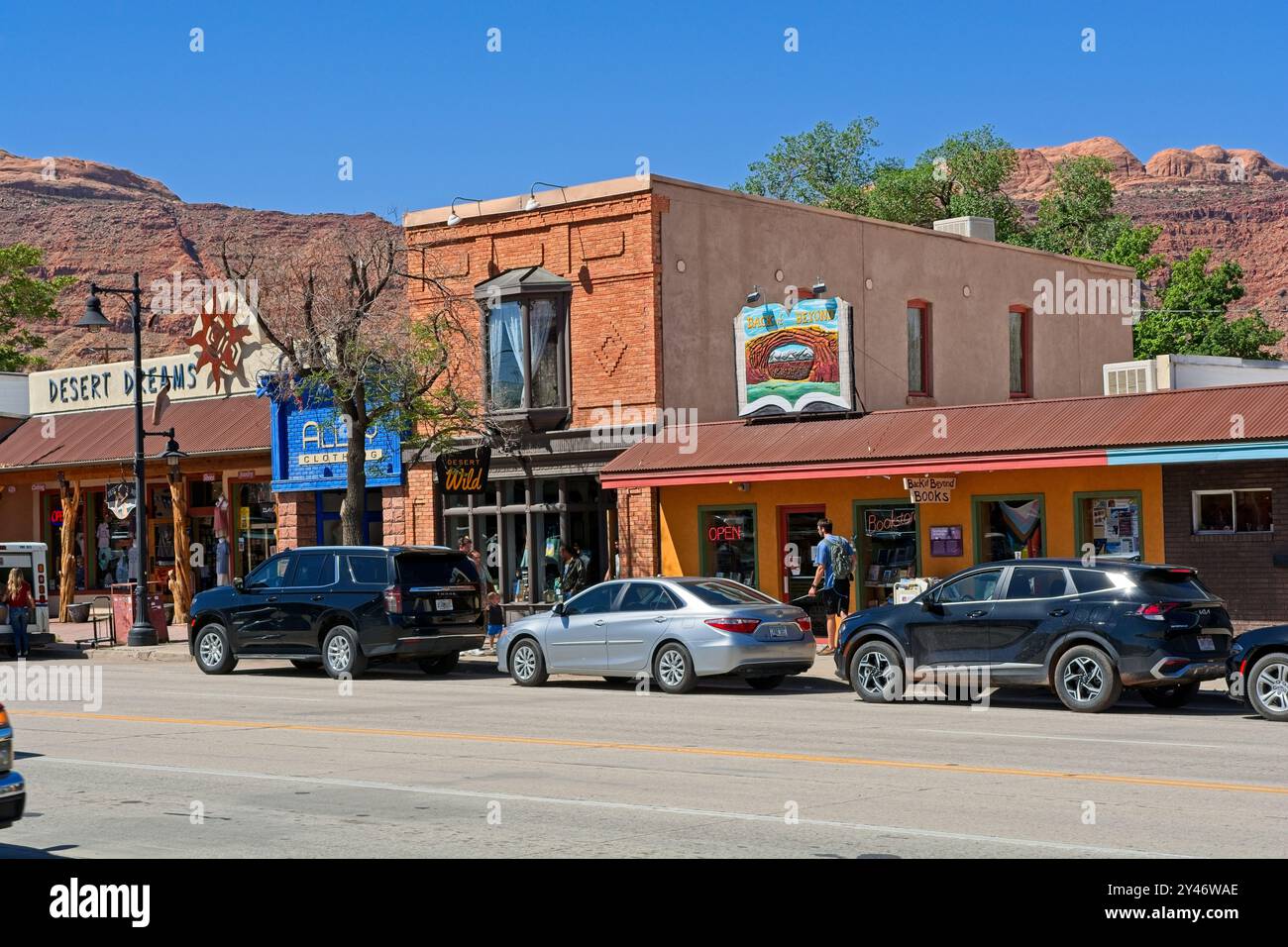 Downtown commercial streetscape with red Moab rim cliffs background ...