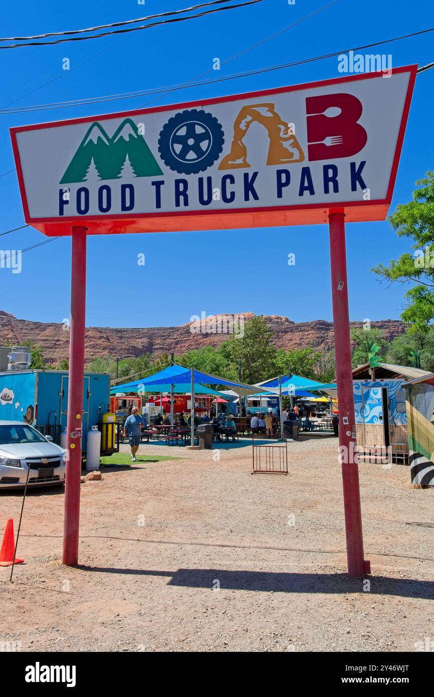 Moab Food Truck Park entrance sign with red Moab rim cliffs background ...