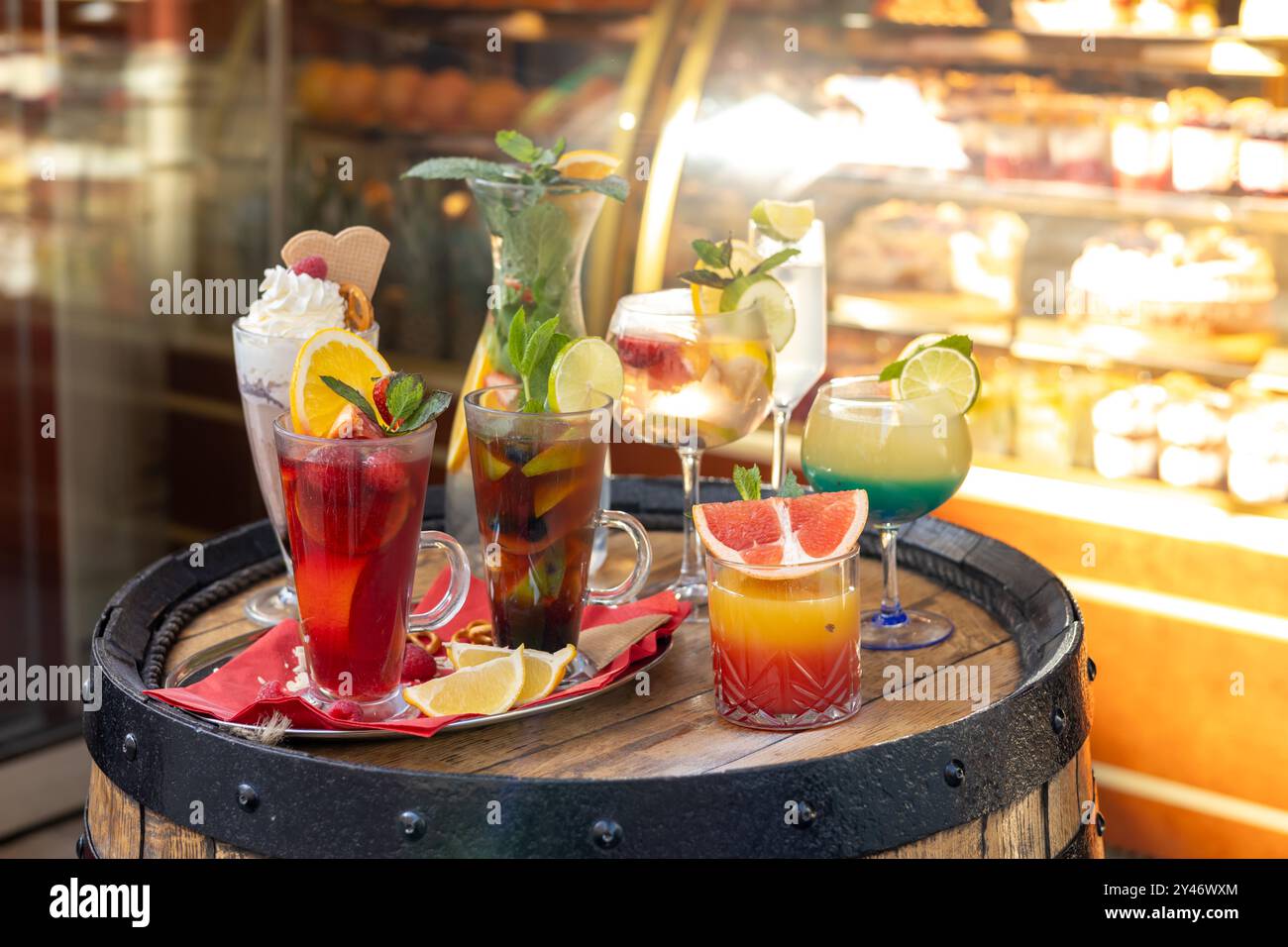 Colorful assortment of refreshing cocktails displayed on a rustic ...