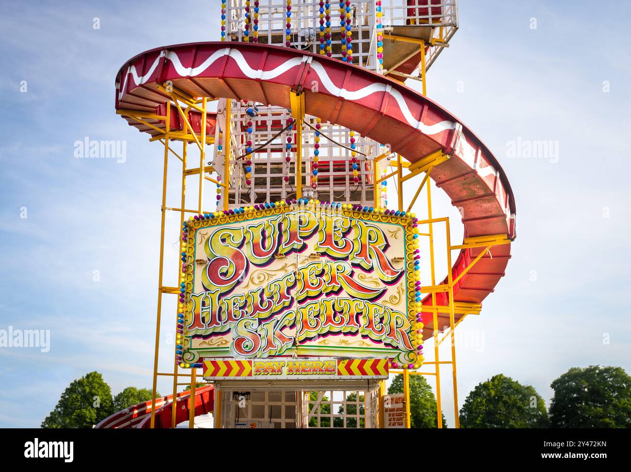 Super Helter Skelter slide ride at British carnival funfair on sunny ...