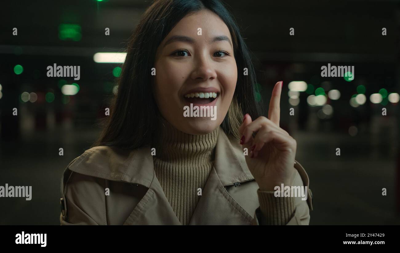 Portrait thoughtful pensive Asian japanese woman in parking dreaming ...