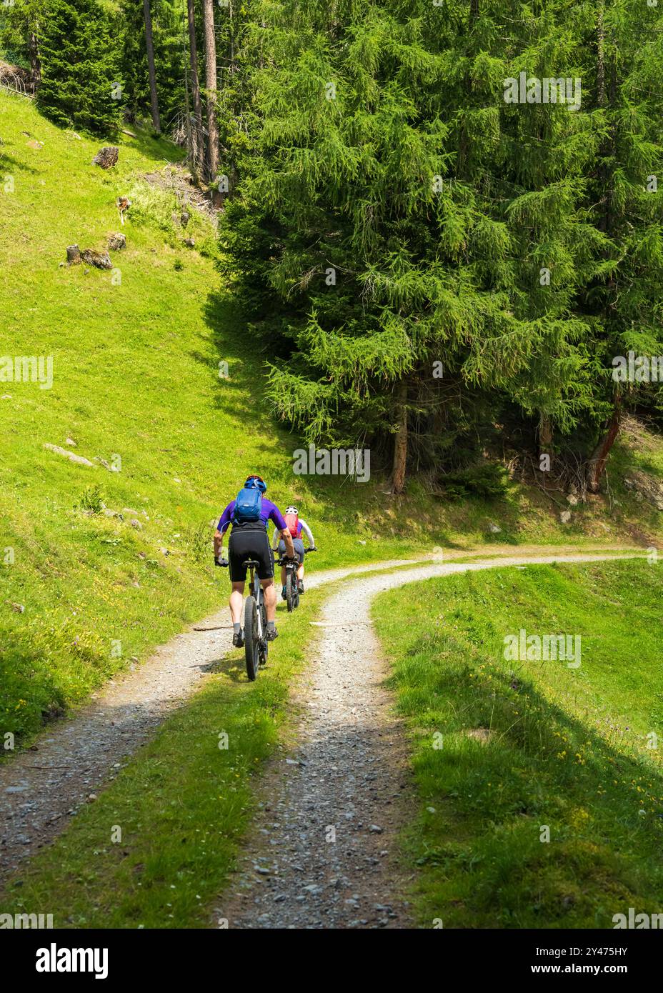 Two cyclists in beautiful mountain hi-res stock photography and images ...