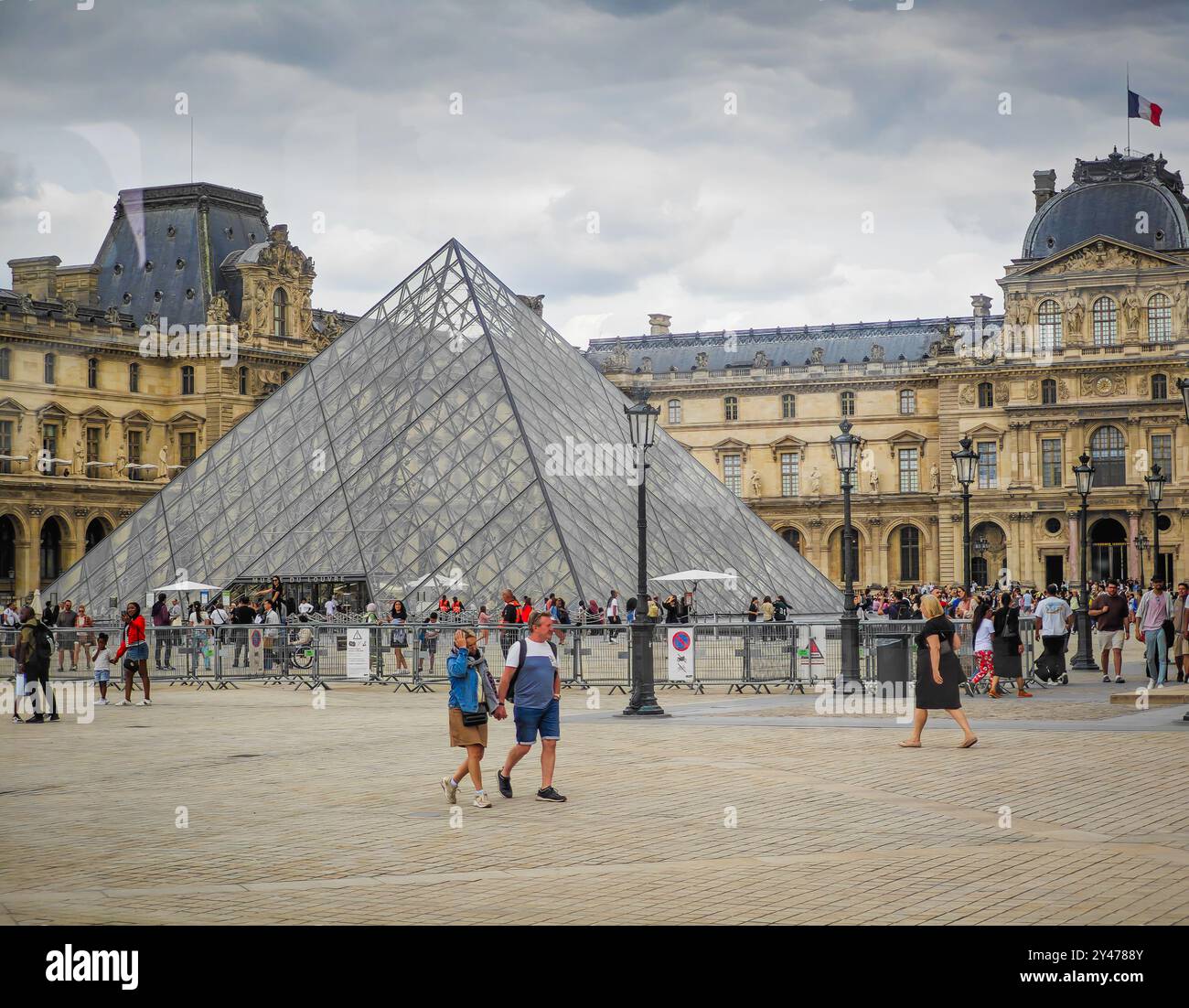 09 16 2024 - Paris, Louvre. The Louvre glass pyramid in the front yard ...