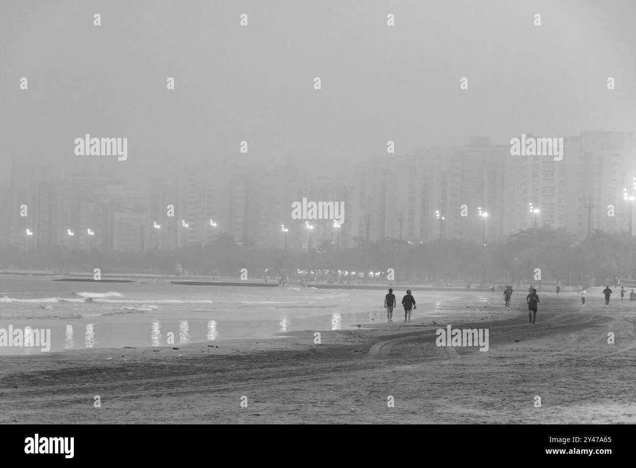 City of Santos, Brazil. Beachfront on a cloudy, foggy day. People ...