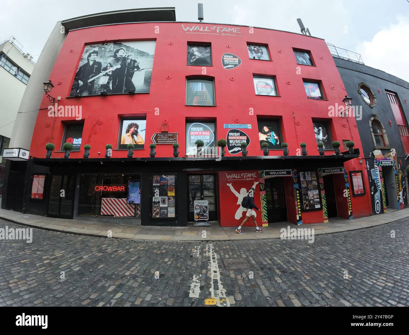 DUBLIN, IRELAND - JULY 26, 2024: man walks under the Rock and Roll ...