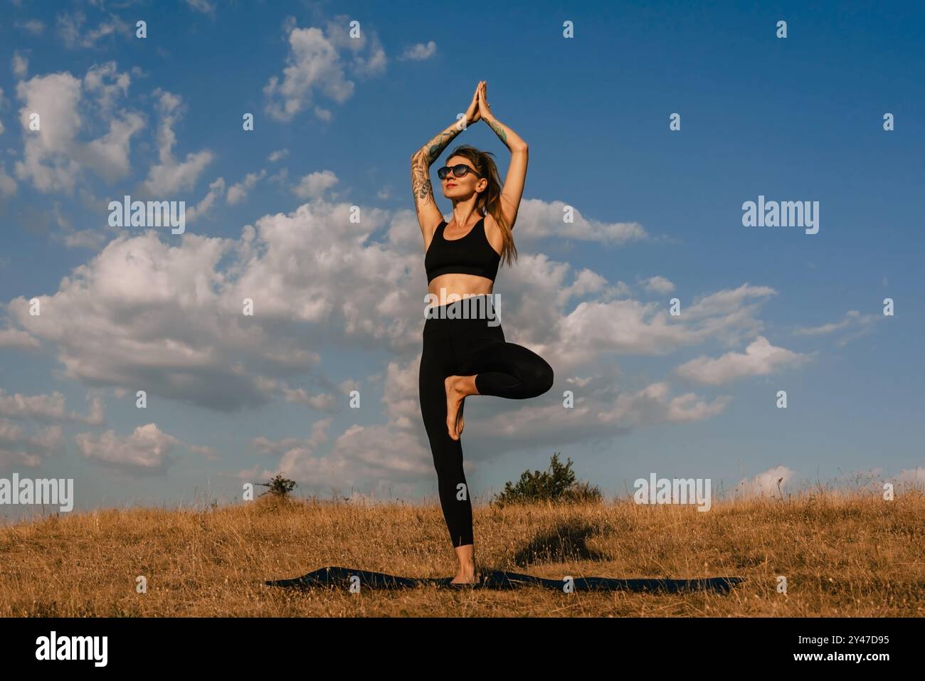 Yogi Woman Balancing in Tree Pose Outdoors Stock Photo - Alamy