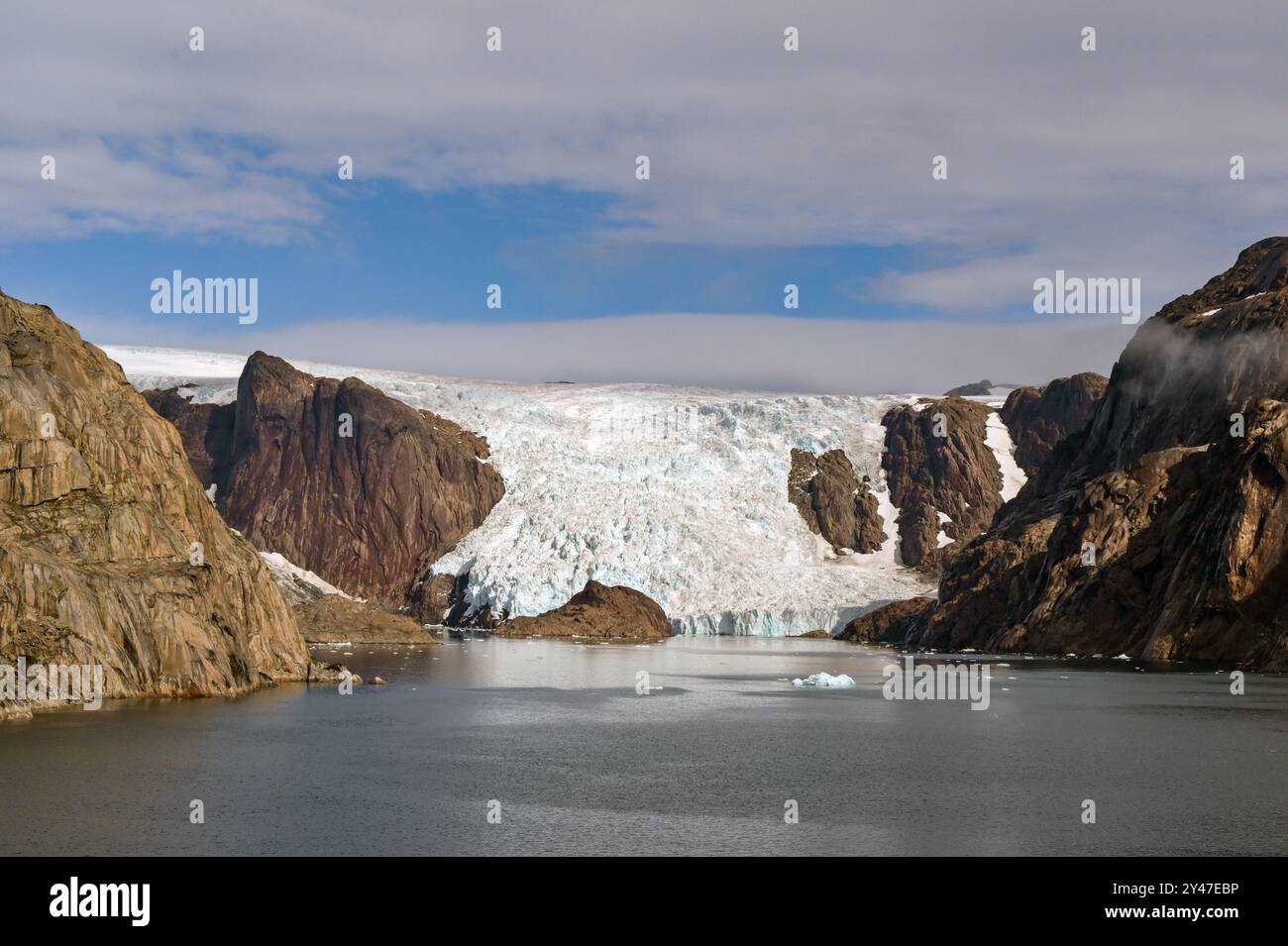 Scenic landscape view of a glacier at the water's edge of a fjord in ...