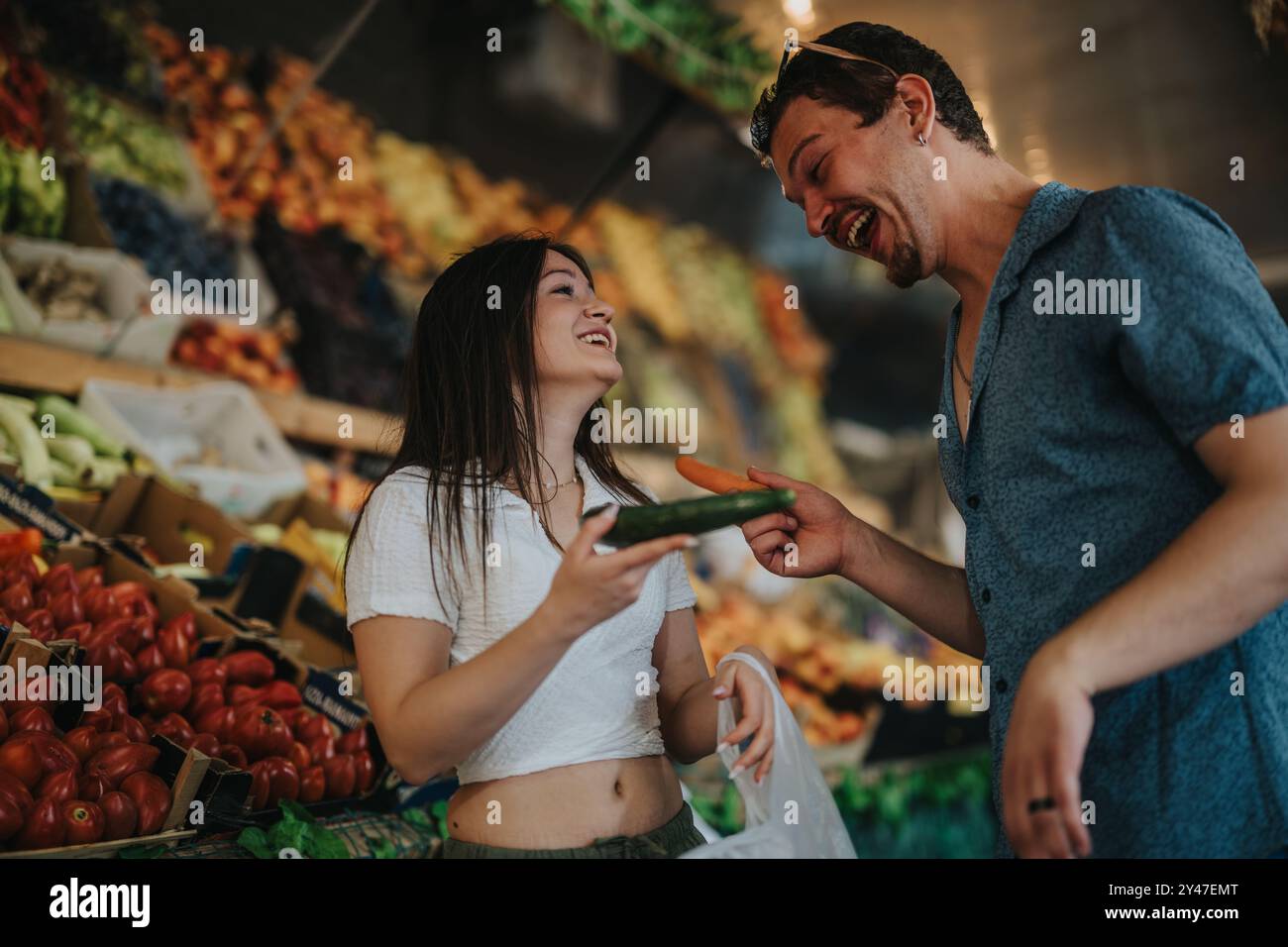Friends happily buying fresh fruits and vegetables at a local market ...