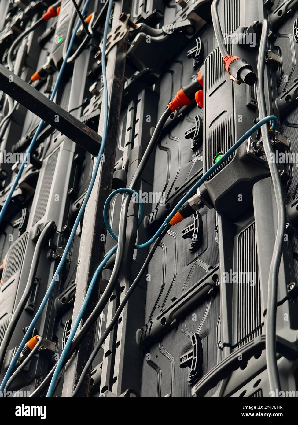 A bunch of electrical wires and connectors are hanging down from a led ...