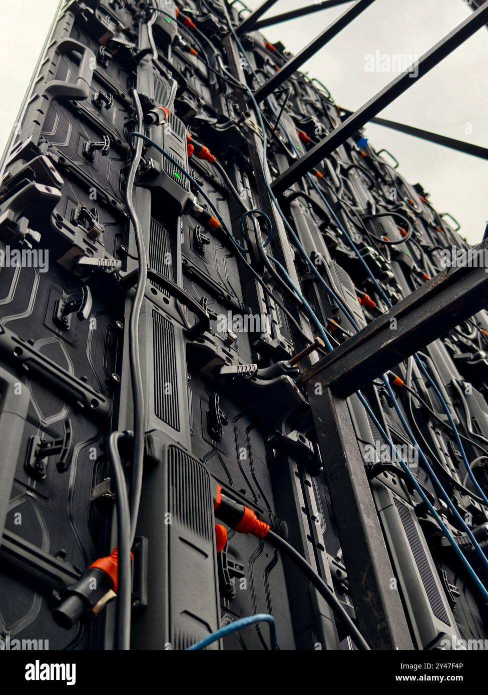 A bunch of electrical wires and connectors are hanging down from a led ...