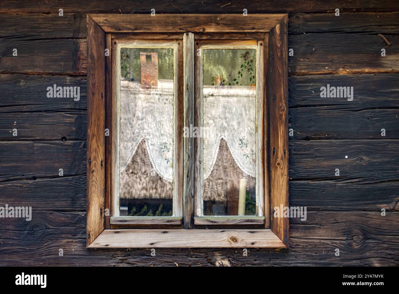 Wooden house window with traditional curtain Stock Photo - Alamy