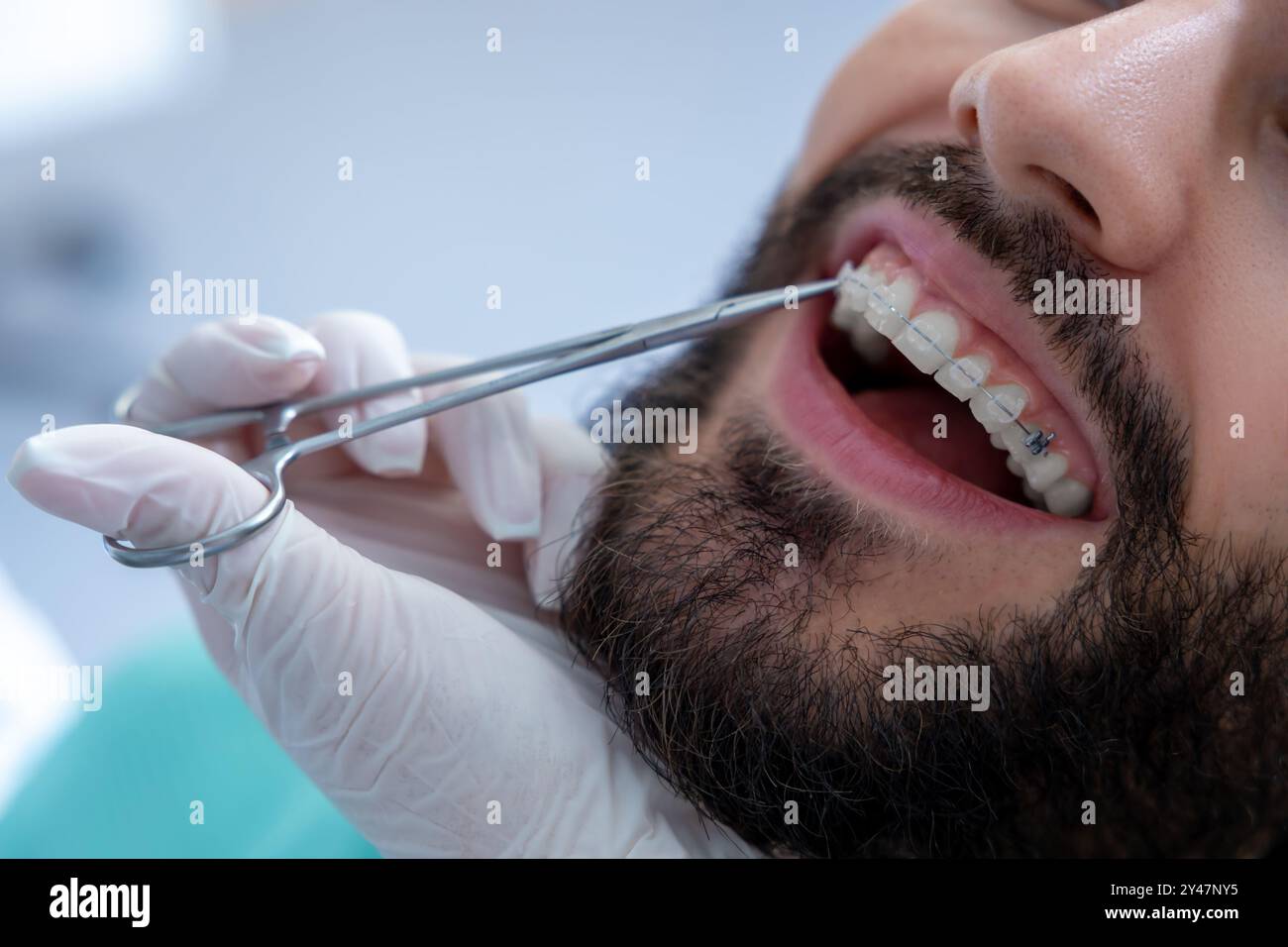 Dentist performing examination with specialized tools during routine ...