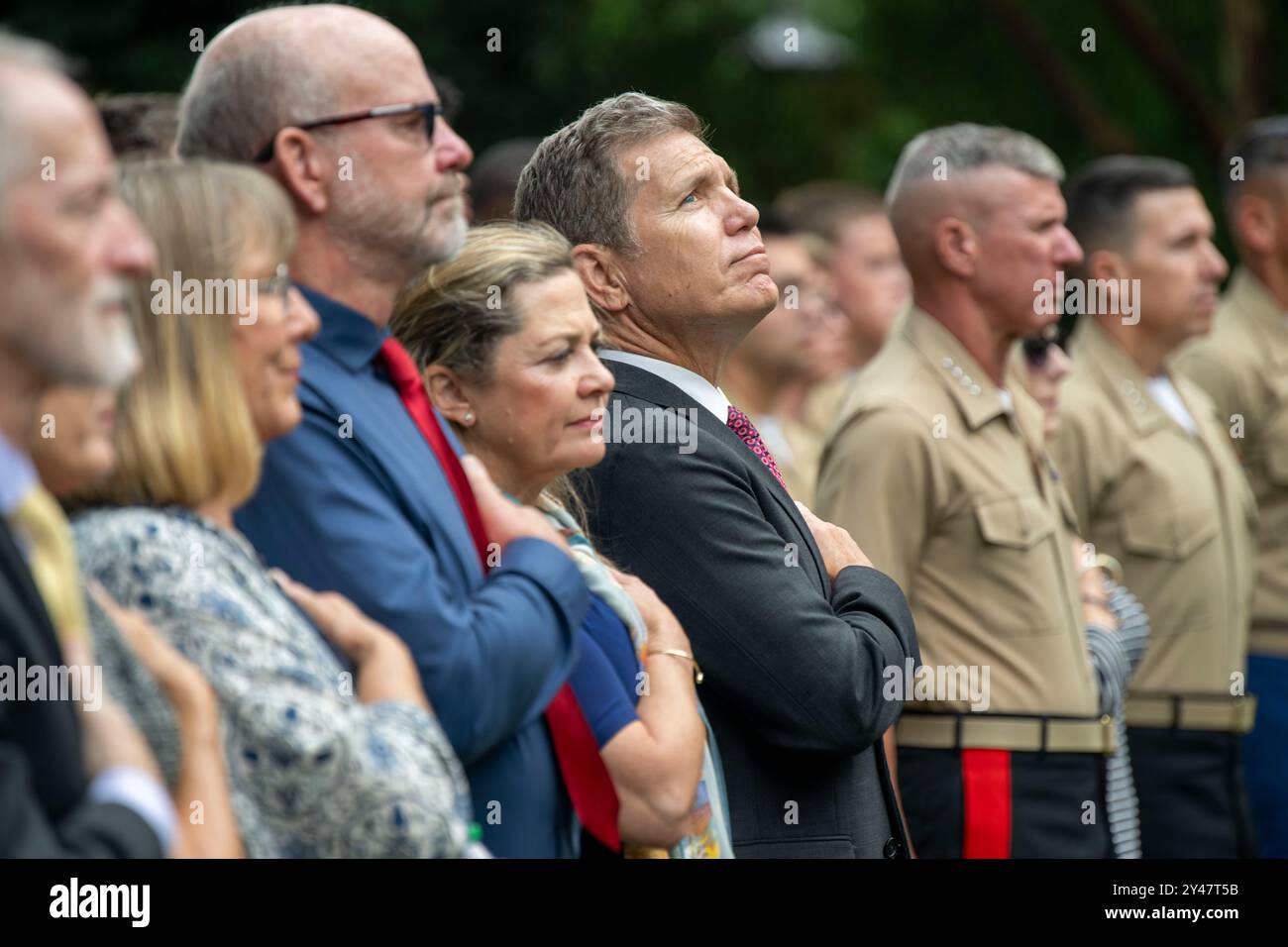 Bart Collart, the father of Cpl. Spencer Collart, looks up during the ...