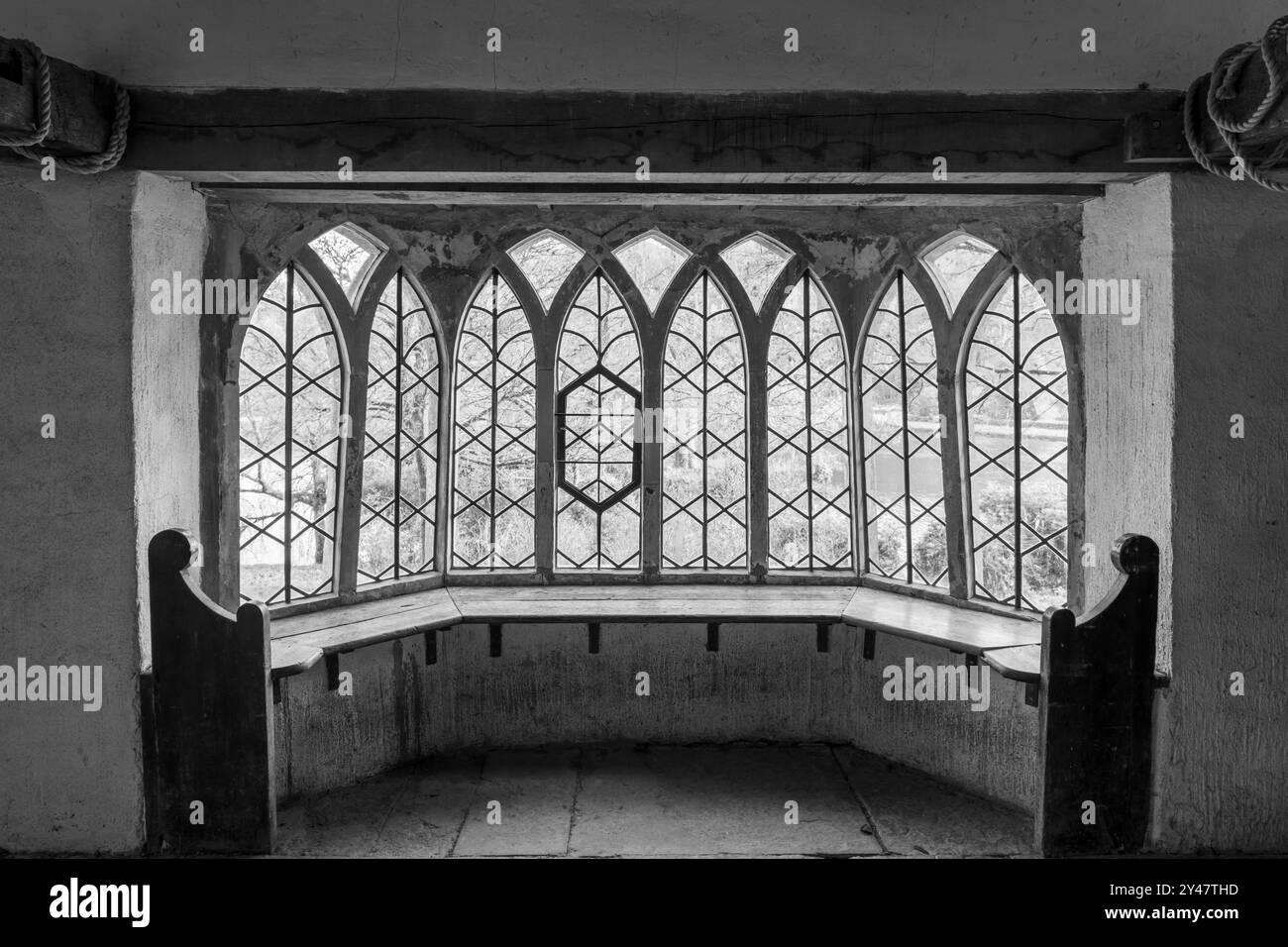 View through the window of the Gothic cottage of the lake at Stourhead ...