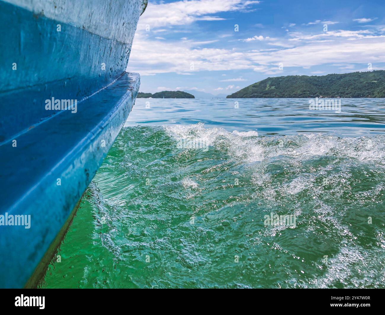 Wooden fishing boat hull sailing in the sea of Paraty bay, Brazil ...