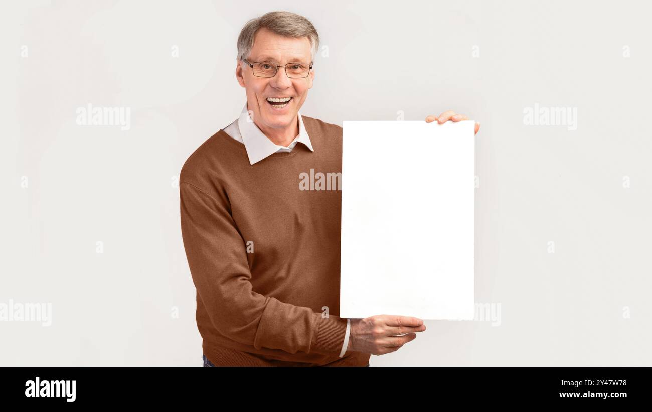 Senior Man Holding White Poster Standing Over Studio Background ...