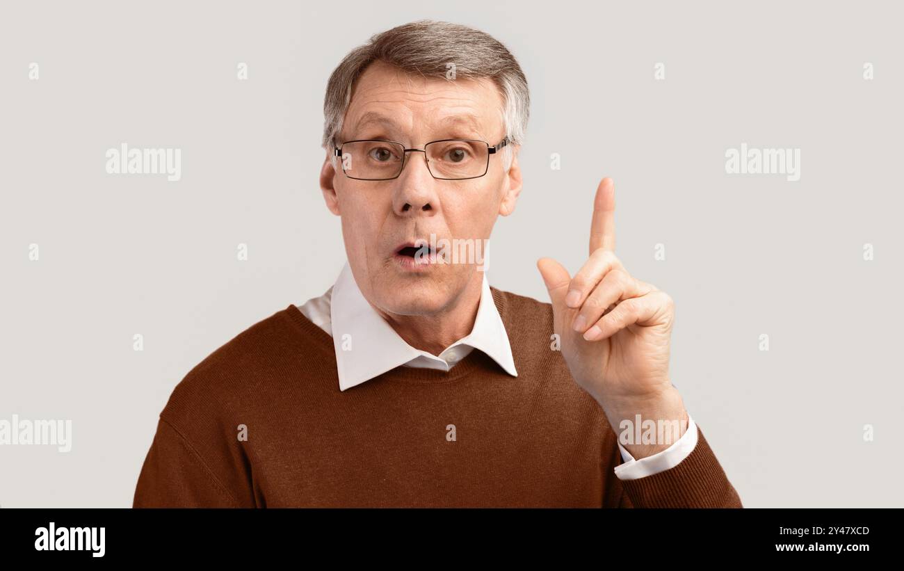 Elderly Gentleman Having Eureka Moment Pointing Finger Up, Studio Shot ...