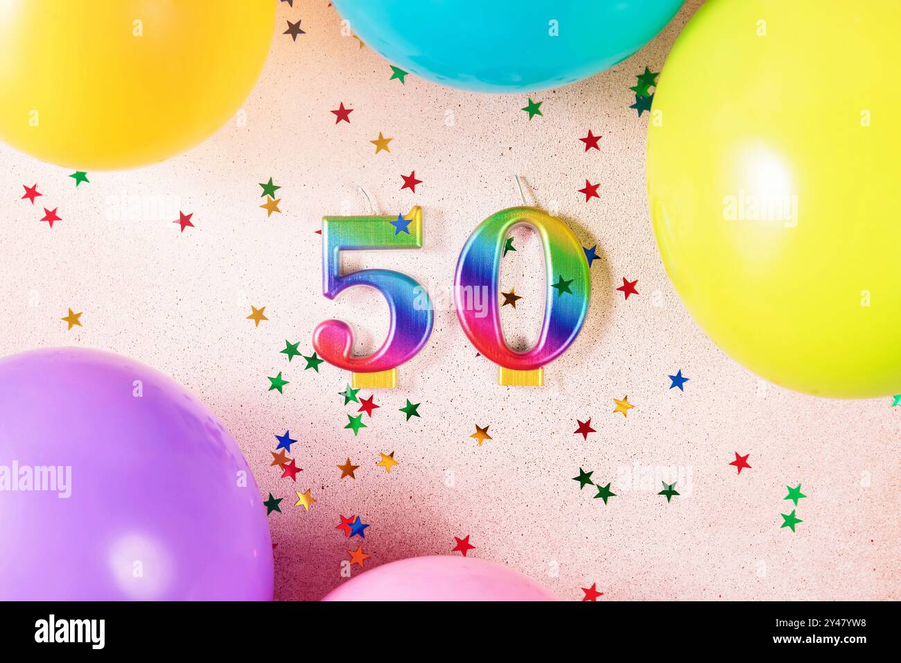 Vibrant Party Setup: Rainbow Number 50 and Balloons Stock Photo - Alamy