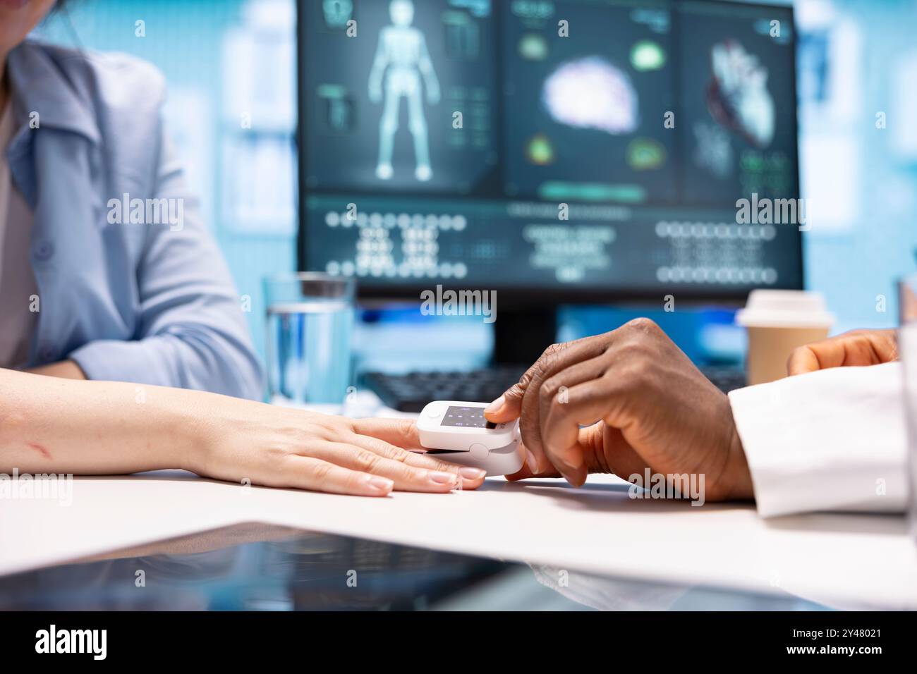 Medical expert taking oxygen saturation levels with an oximeter, doing ...