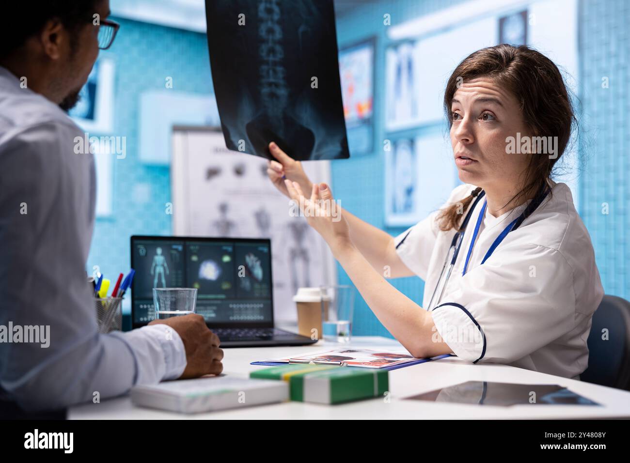 Physician presenting x ray imaging for the right diagnostic during ...