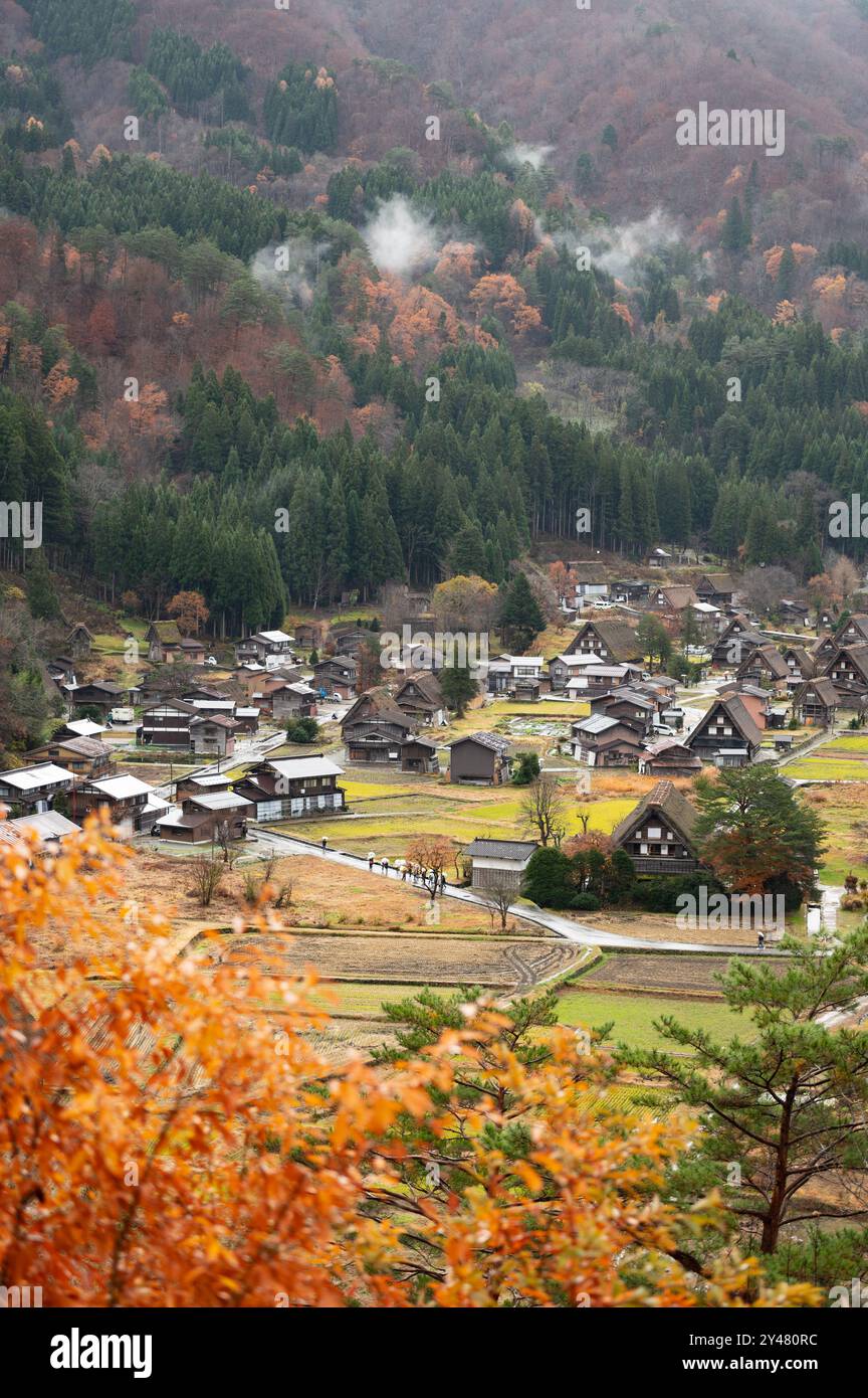 Elevated view of a traditional Japanese village nestled among autumn ...