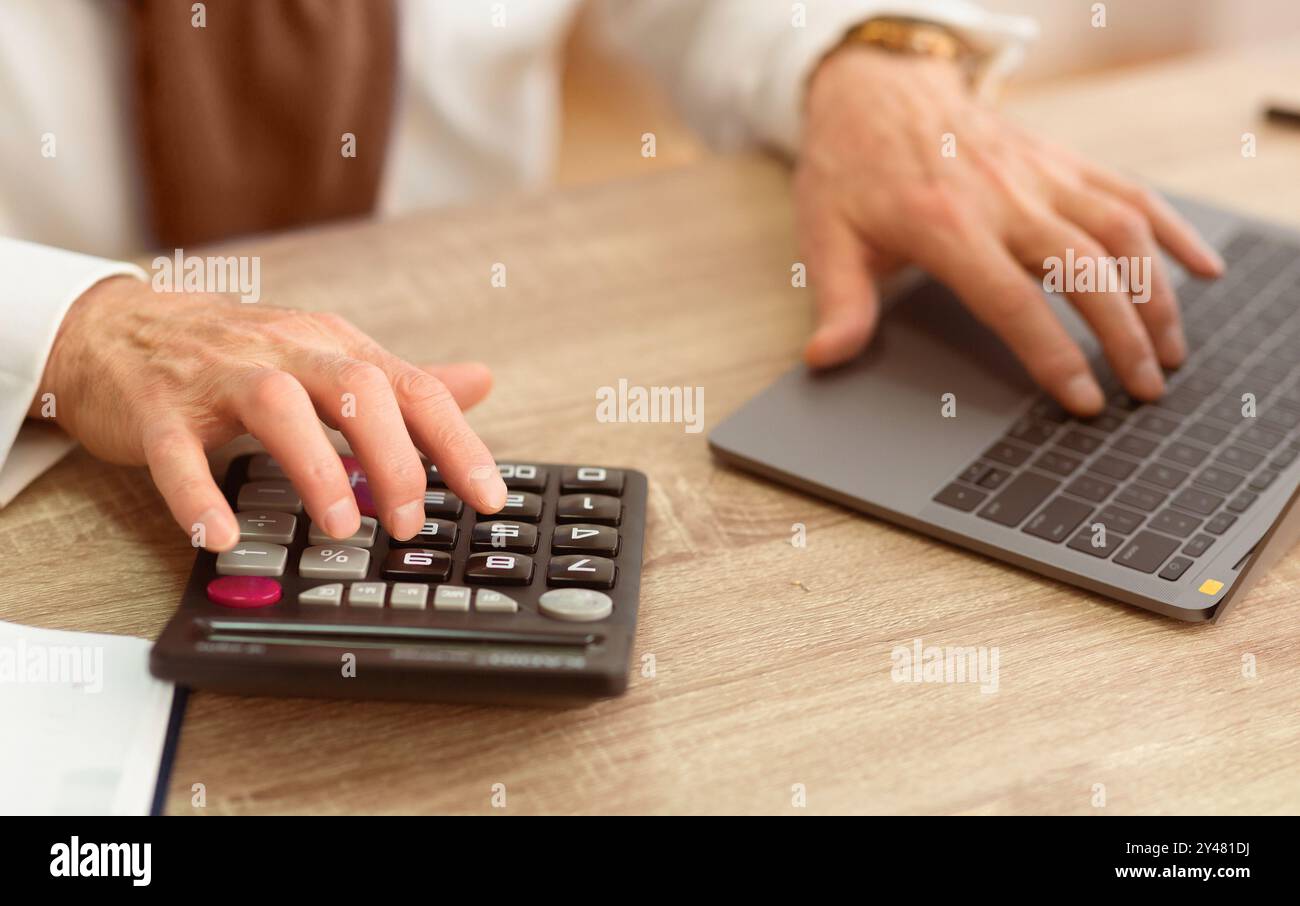Mans hands calculator office hi-res stock photography and images - Alamy