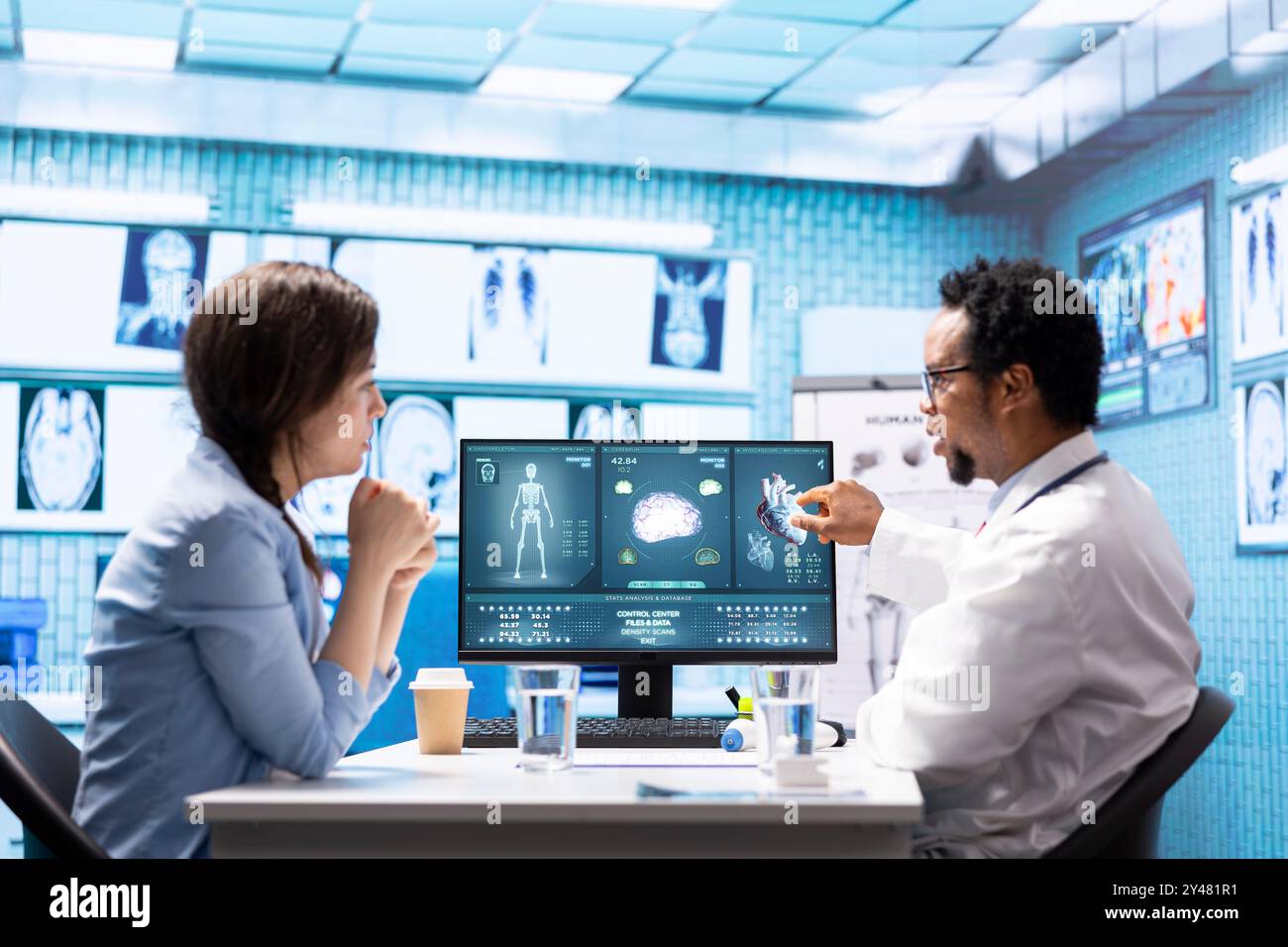 Medic expert showing the x ray imaging test results to patient at check ...