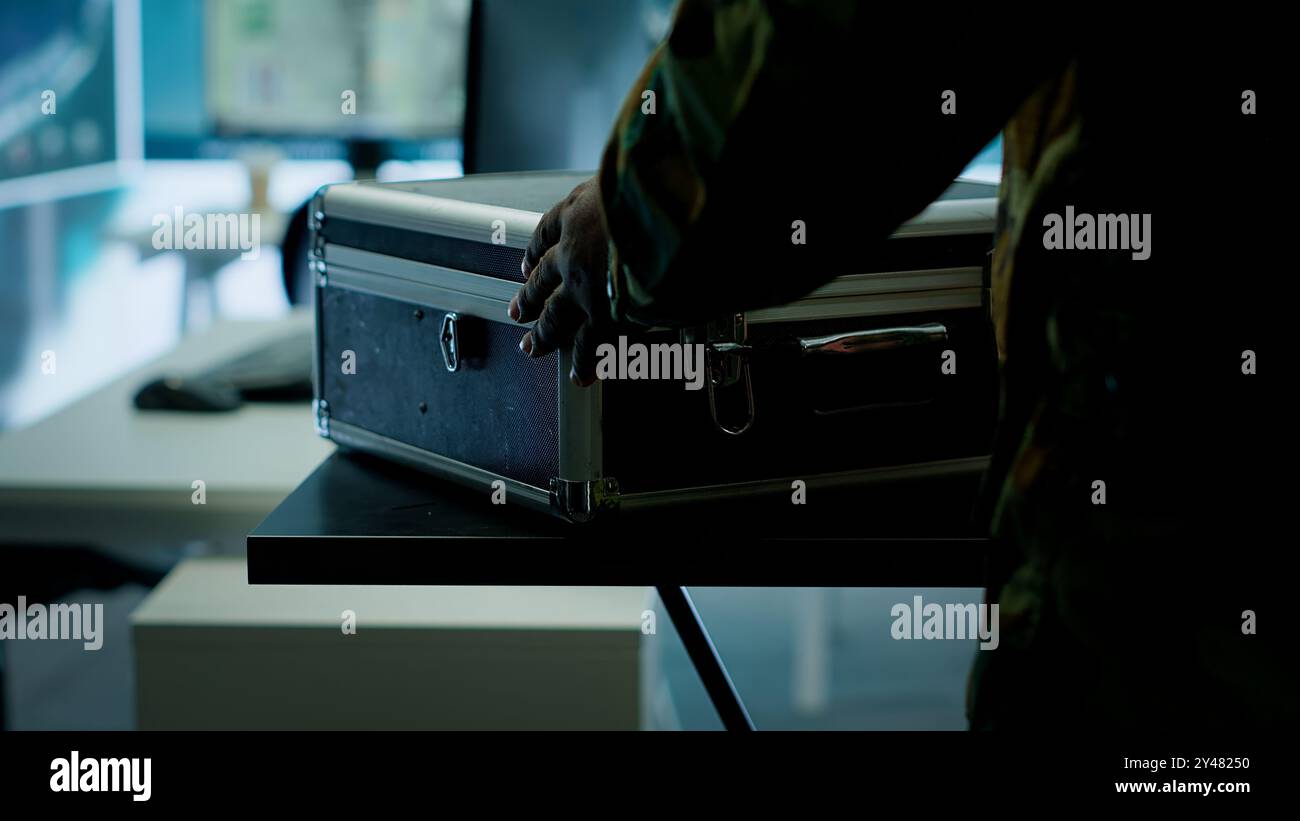 Military personnel operating in a secure office environment, processing ...
