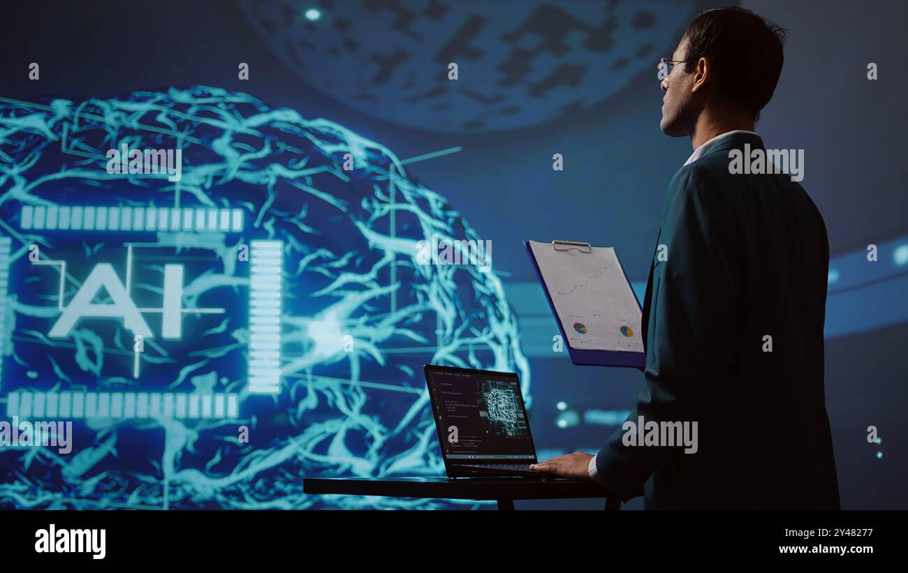 Startup employee looking over business charts, using AI software to ...