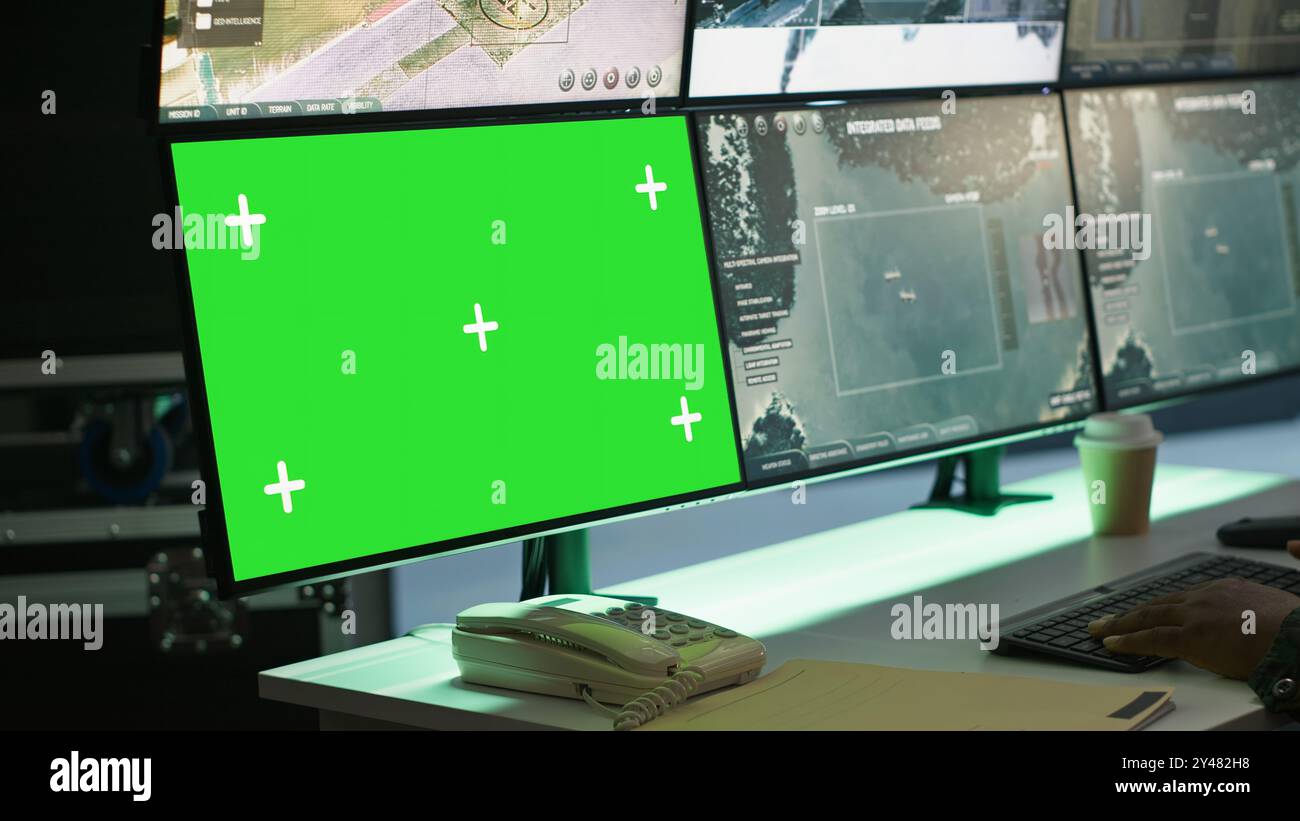 Soldier in military HQ base using green screen equipment to gather ...