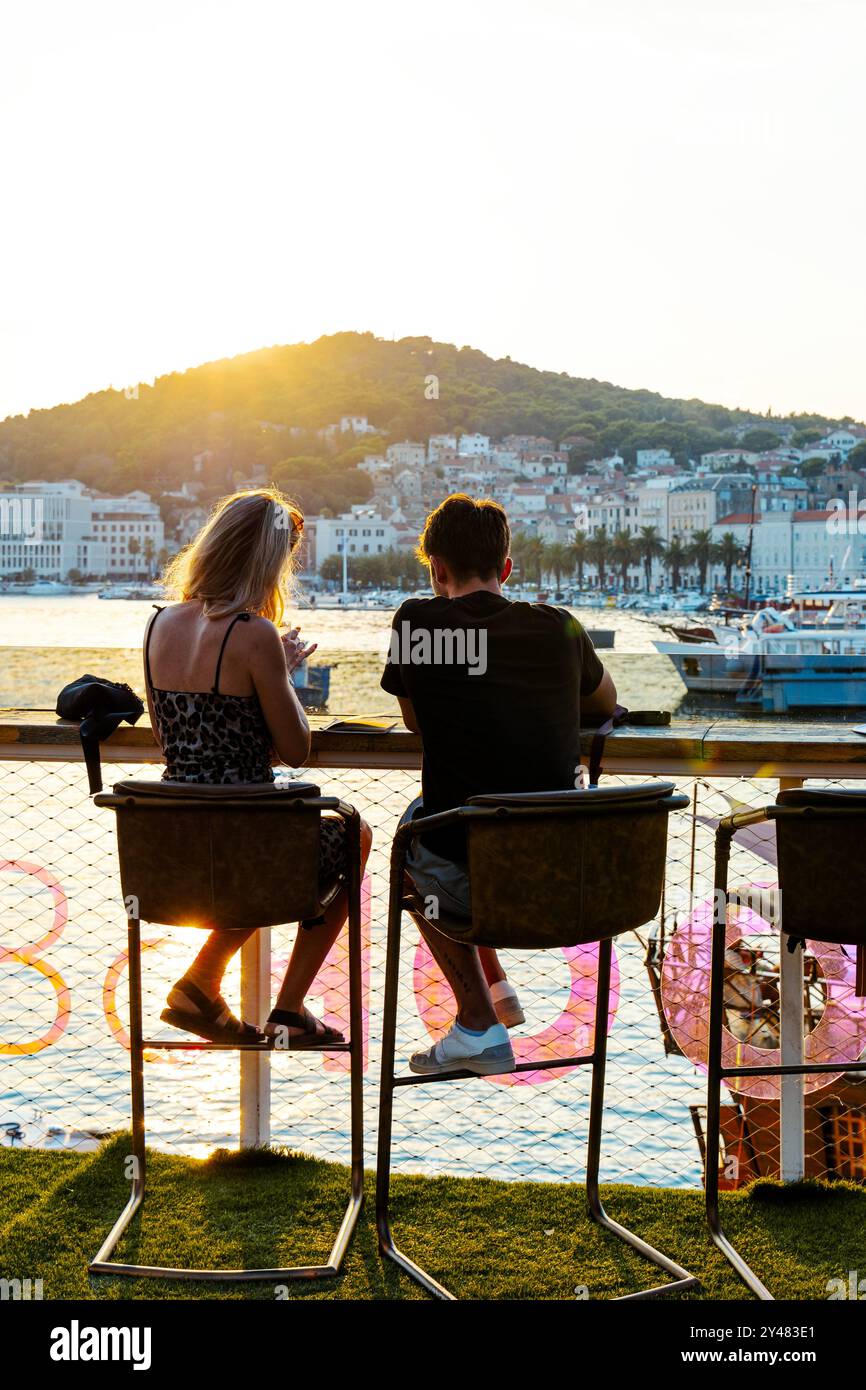People enjoying sunset views of the city from ROOF 68 Restaurant and ...