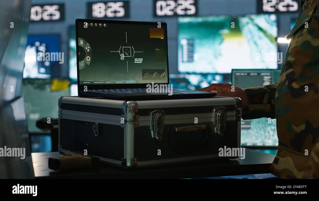 Air force officer performing tactical level surveillance in command room using laptop. Close up ...