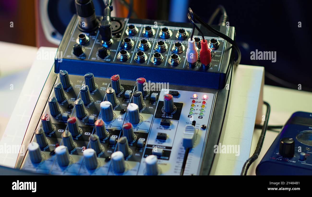 Empty home studio desk with motorized faders and pre amp knobs used ...