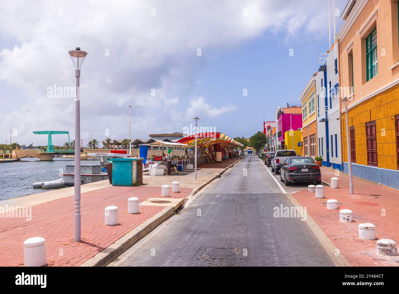 Beautiful street view of colorful buildings and market stalls along ...