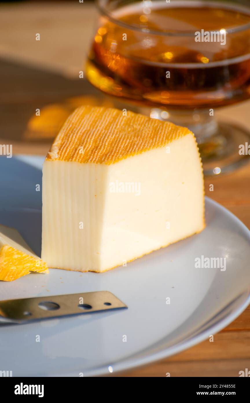 Piece of Saint Paulin creamy, mild, semi-soft French cheese made from ...