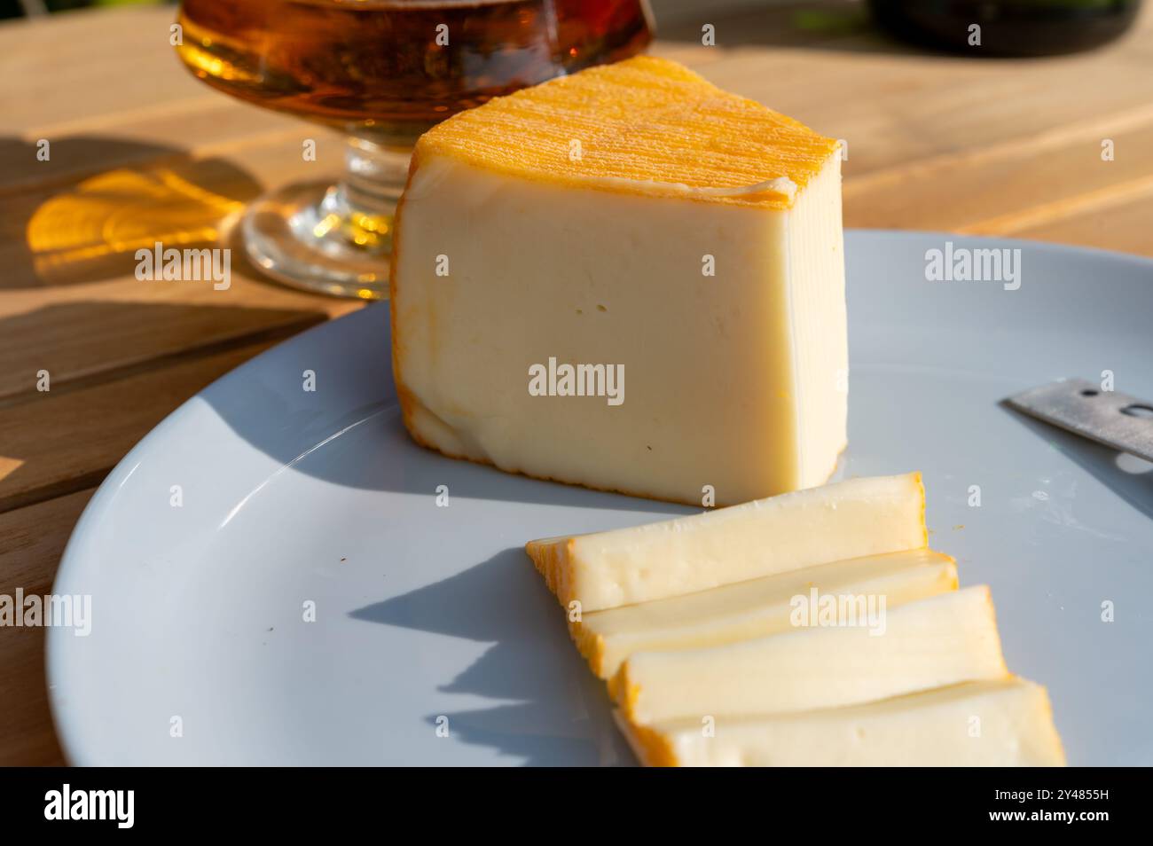 Piece of Saint Paulin creamy, mild, semi-soft French cheese made from ...