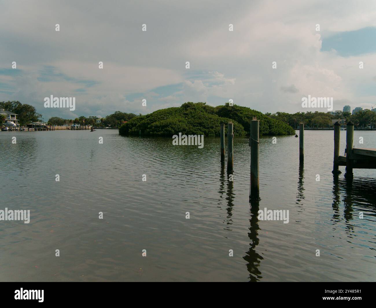 Wide view over water to Coffee Pot Bayou bird preserve a small island ...