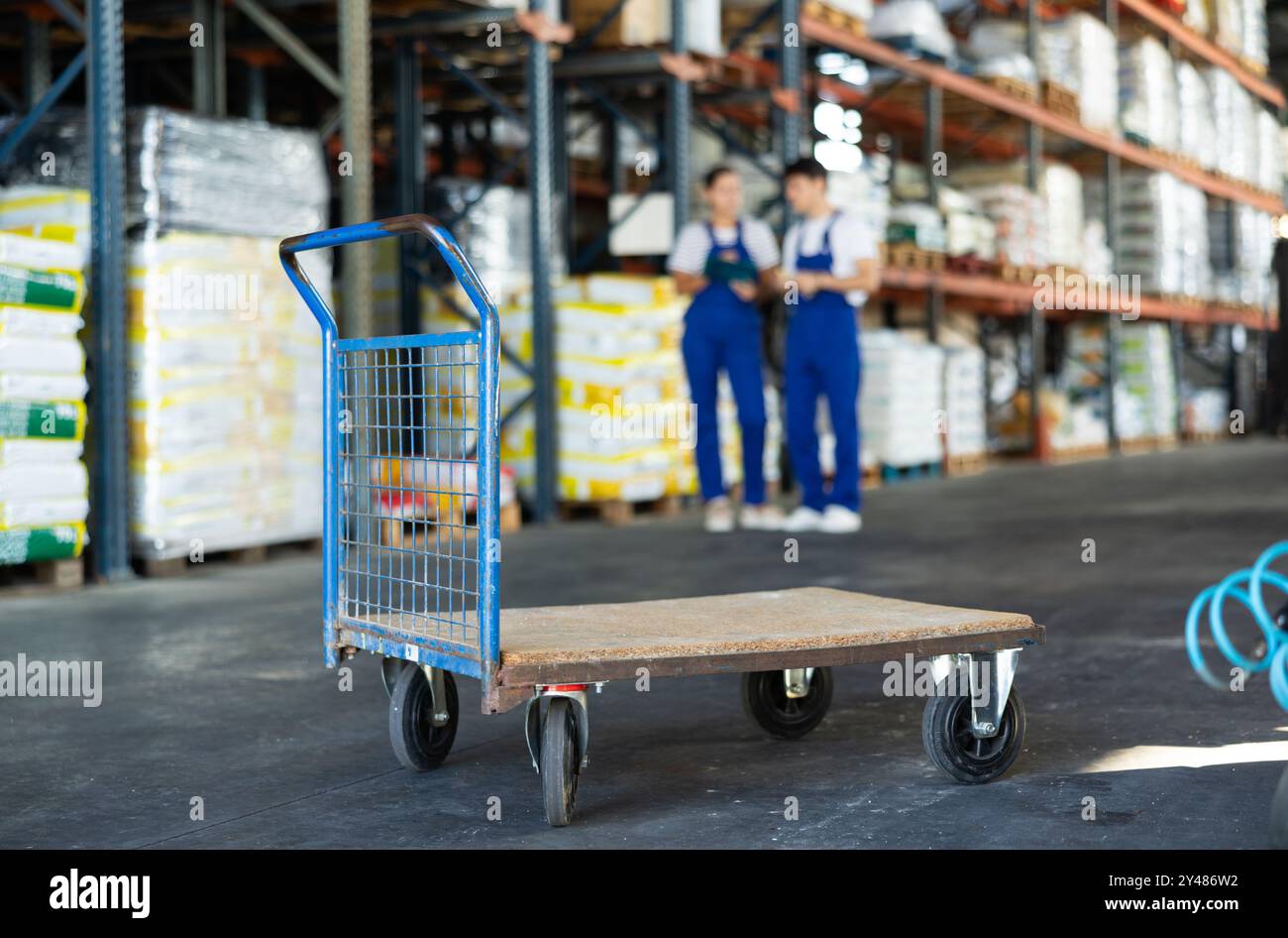 Large cargo trolley stands in premises of store-warehouse of ...