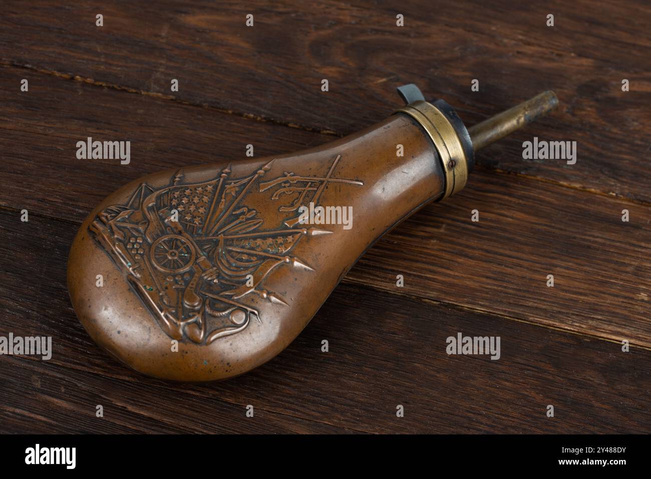 Old west gunpowder flask on wood deck background Stock Photo - Alamy