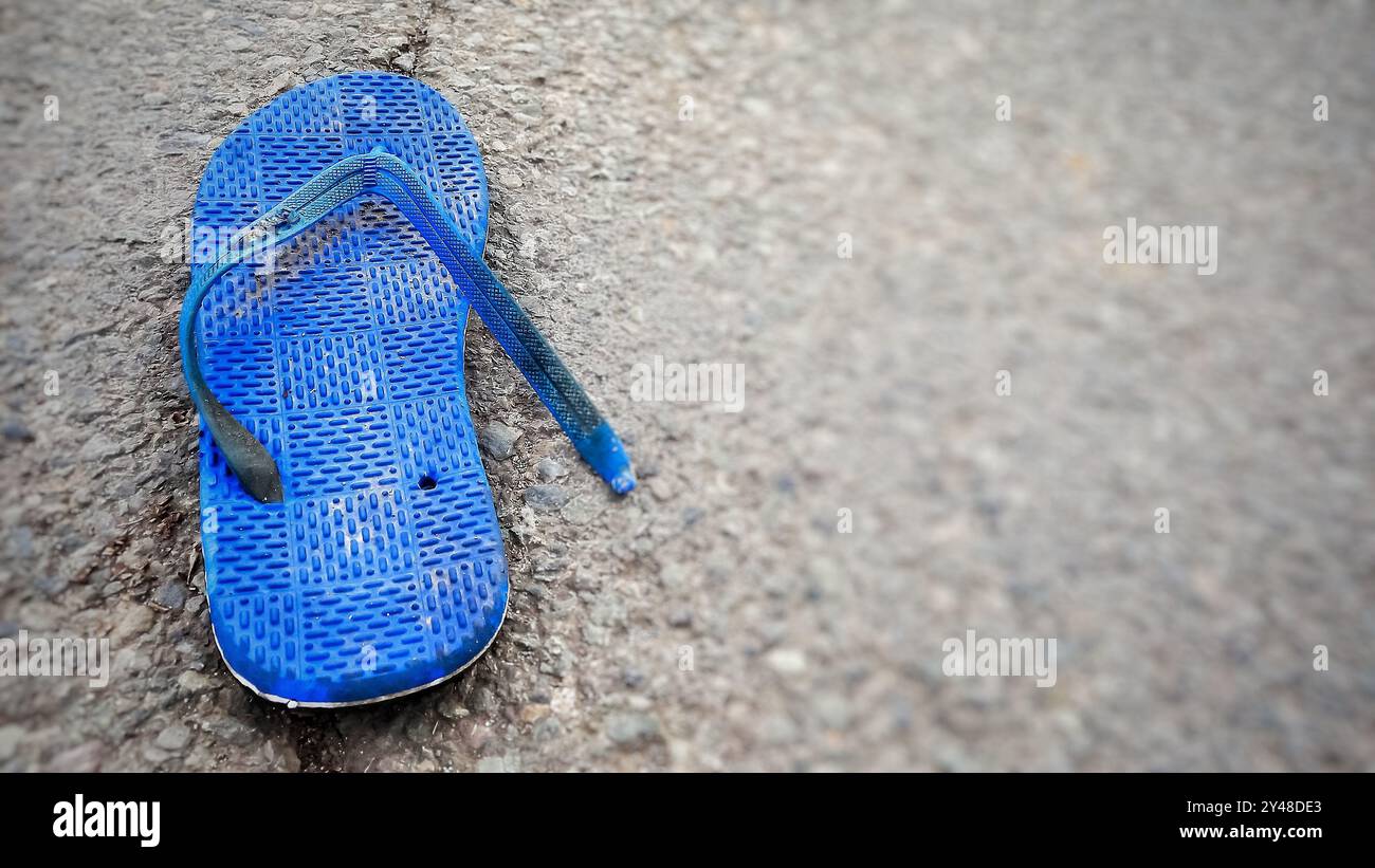 old grungy broken slippers taken high angle Stock Photo - Alamy