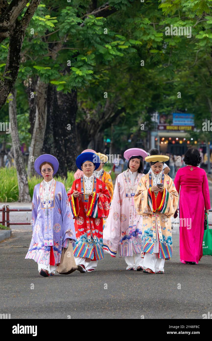 Women in traditional costume visiting the Citadel in HUe, Vietnam Stock ...