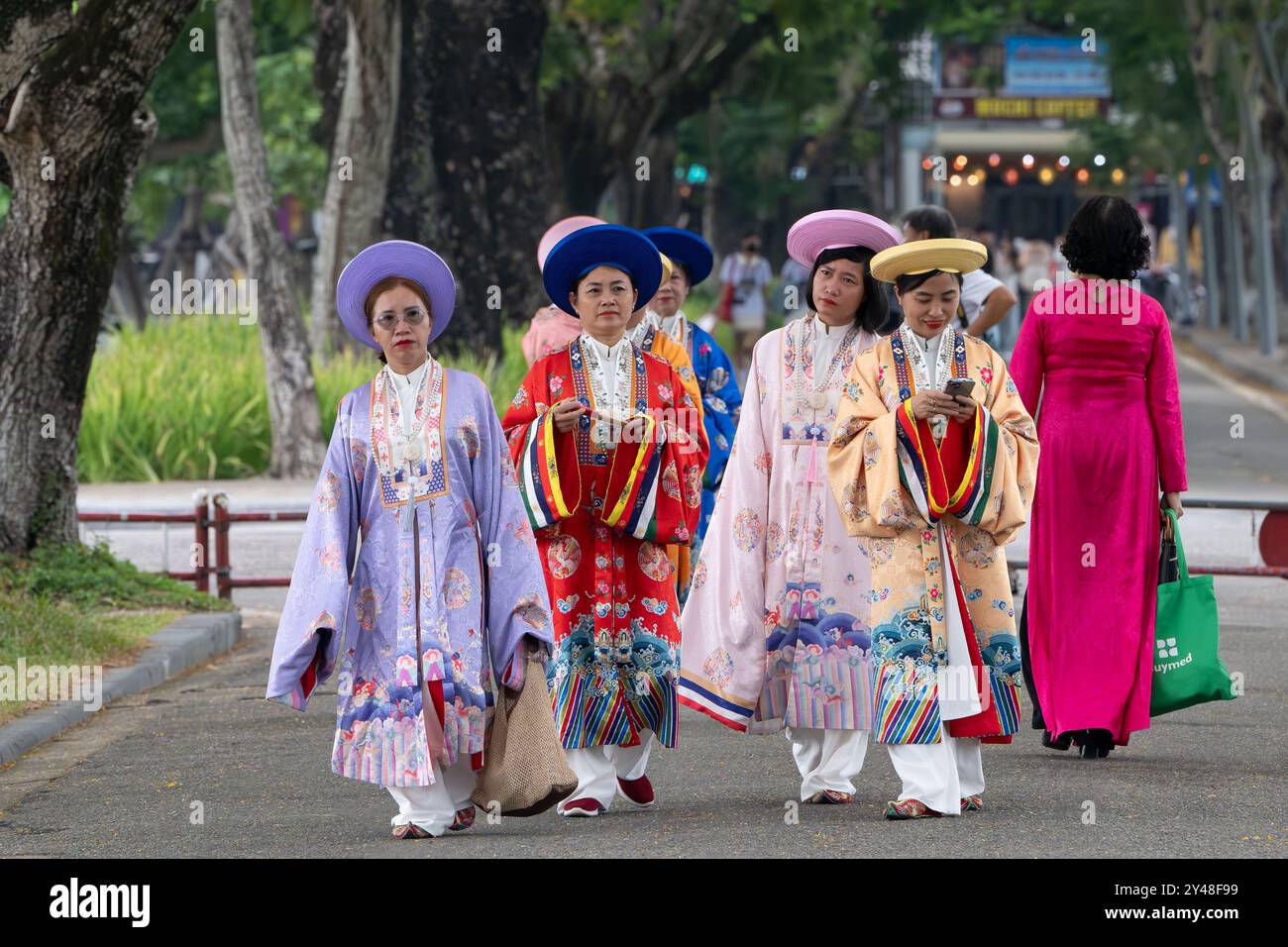 Women in traditional costume visiting the Citadel in HUe, Vietnam Stock ...