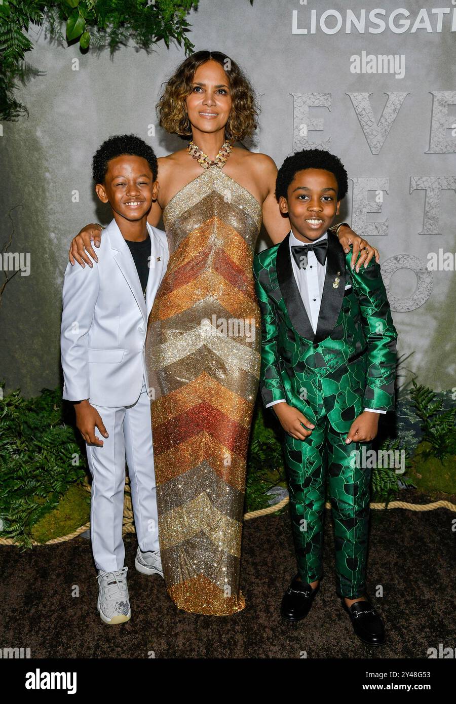Halle Berry, center, poses with Percy Daggs IV, left, and Anthony B ...