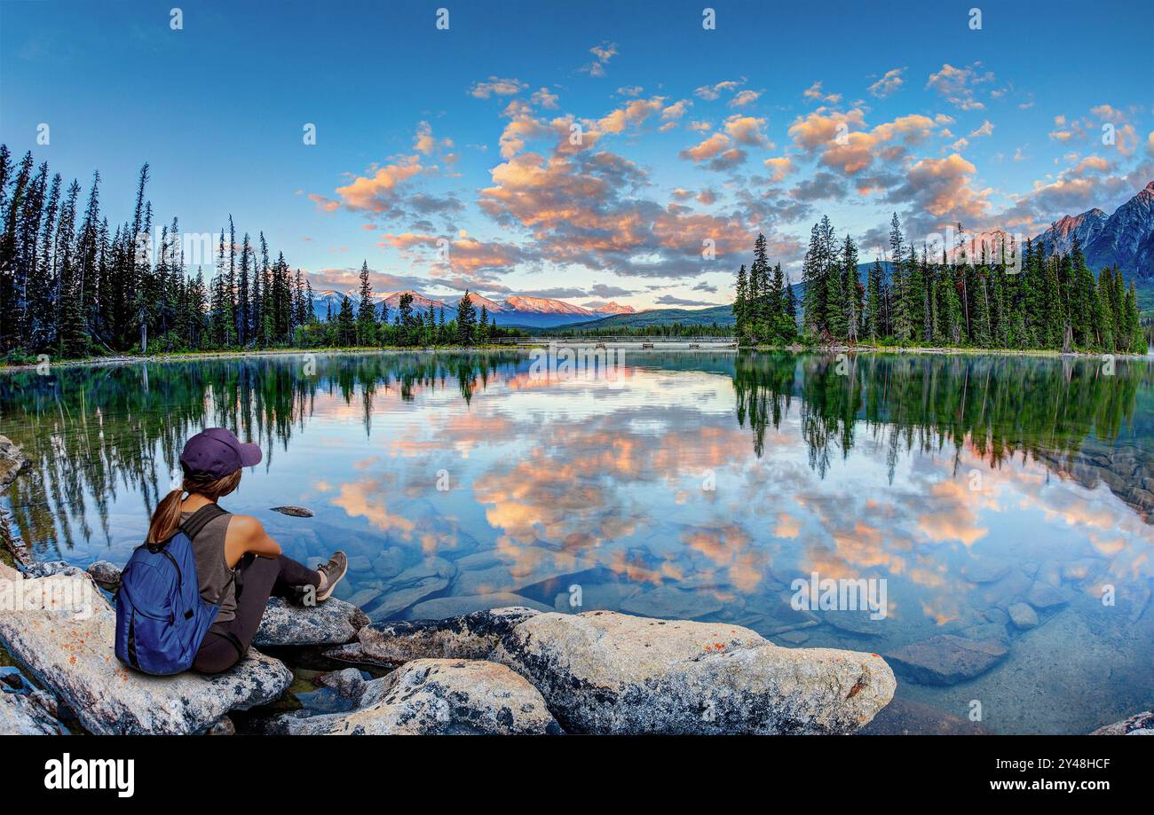 Girl hiker catching first glimpse of golden Summer sunrise at Pyramid ...