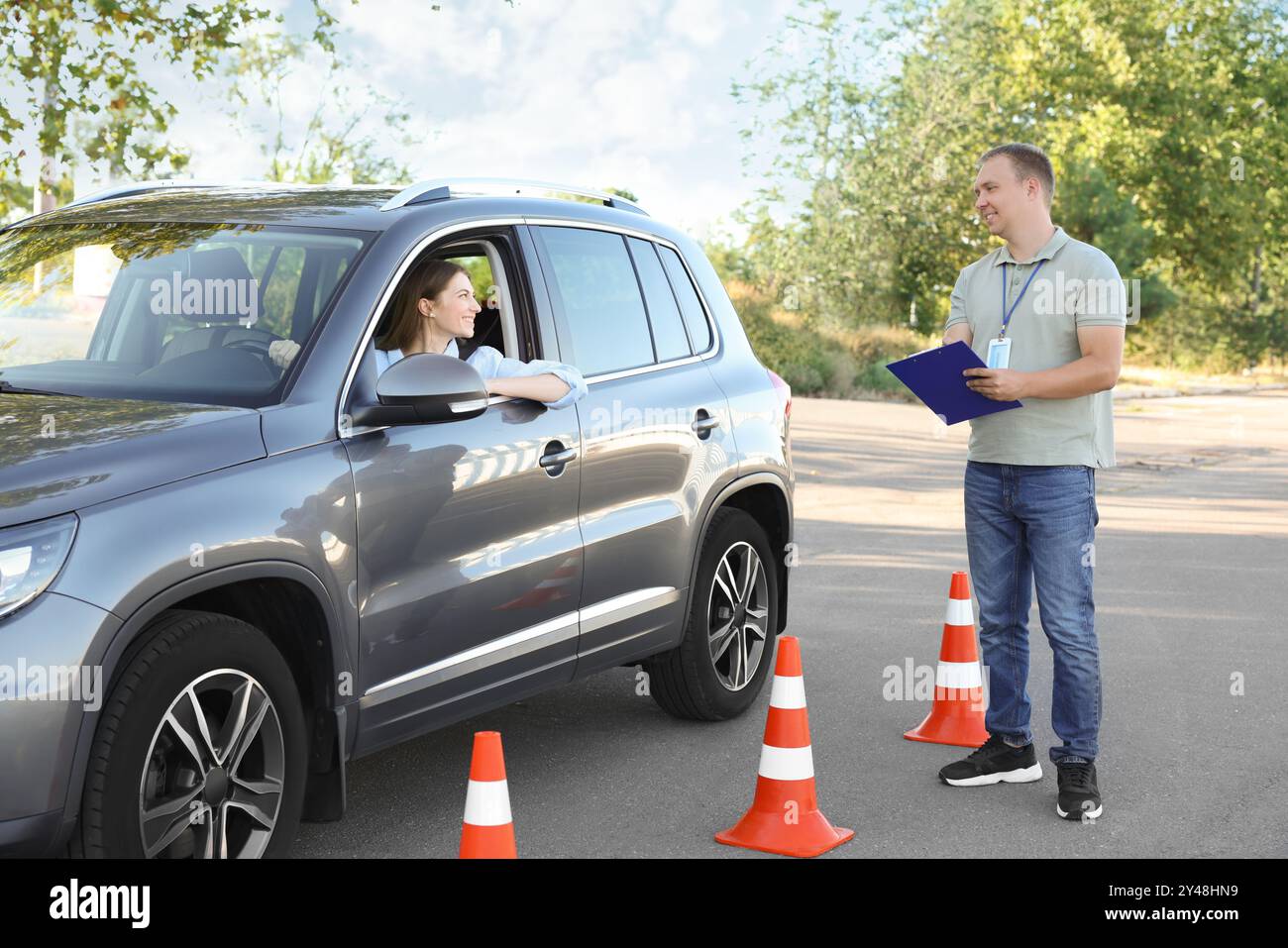 Woman passing maneuverability driving test on track Stock Photo - Alamy