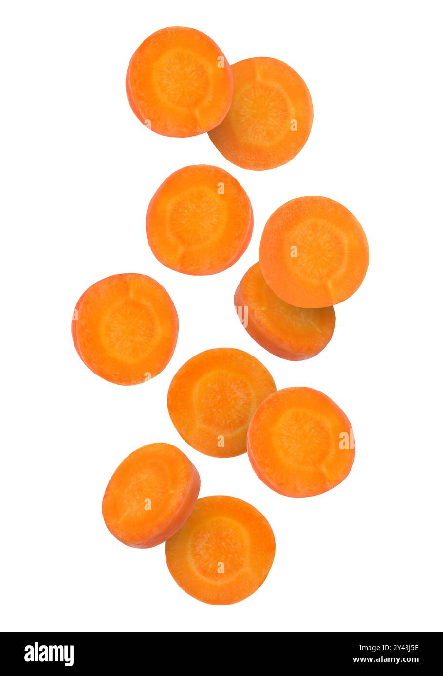 Round carrot slices in air on white background Stock Photo - Alamy