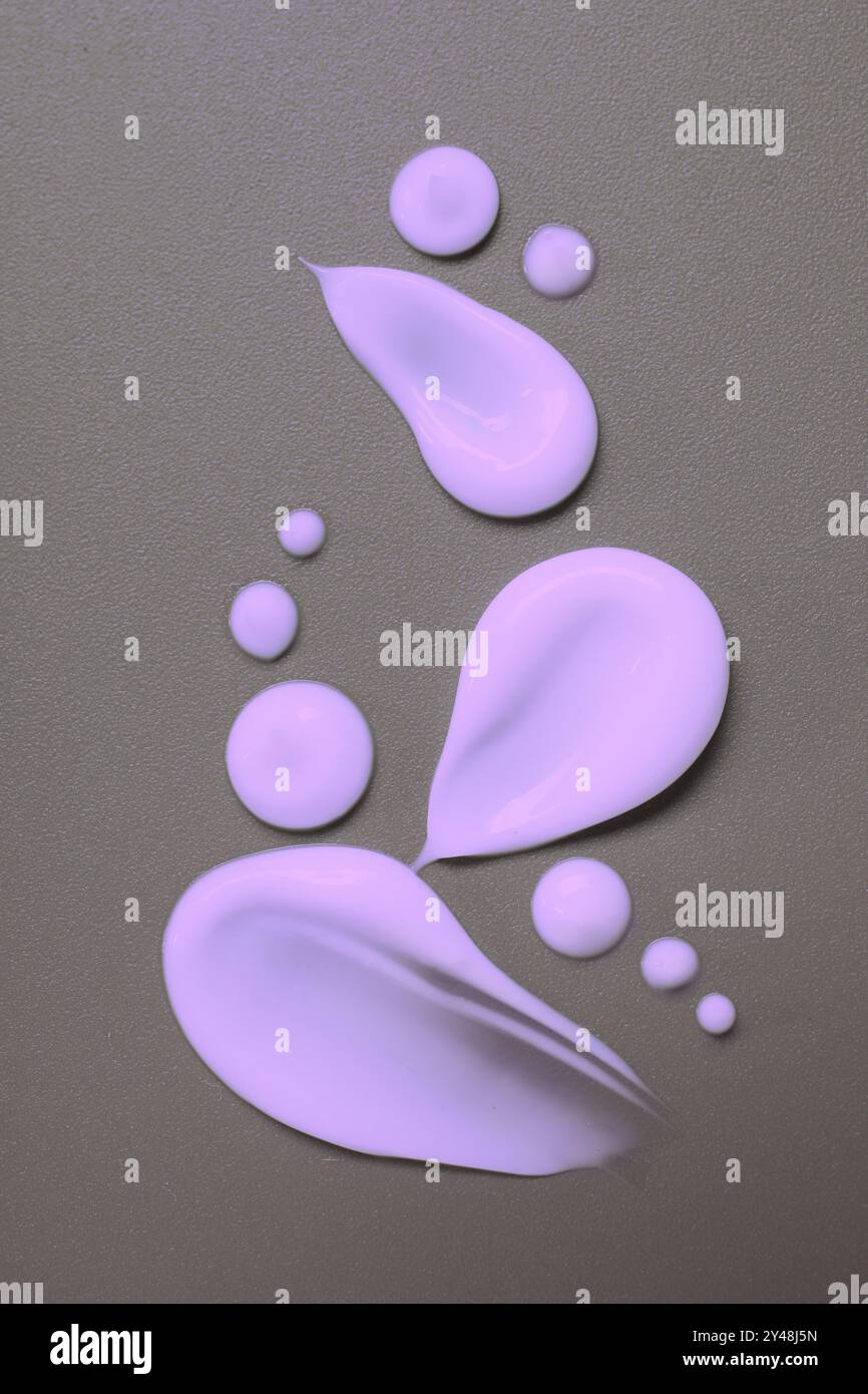 Samples of violet face cream on grey background, flat lay Stock Photo ...